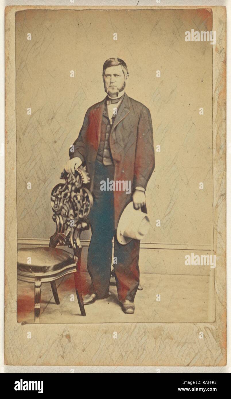 man with long muttonchops, standing, holding a white hat, Charles E ...