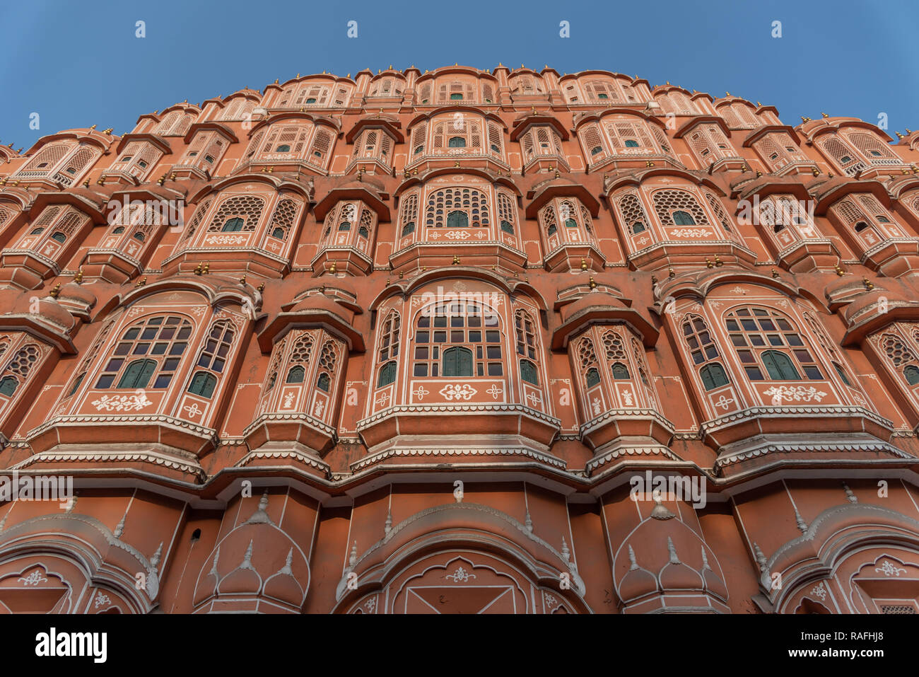 The red and pink sandstone Hawa Mahal Palace facade in Jaipur ...