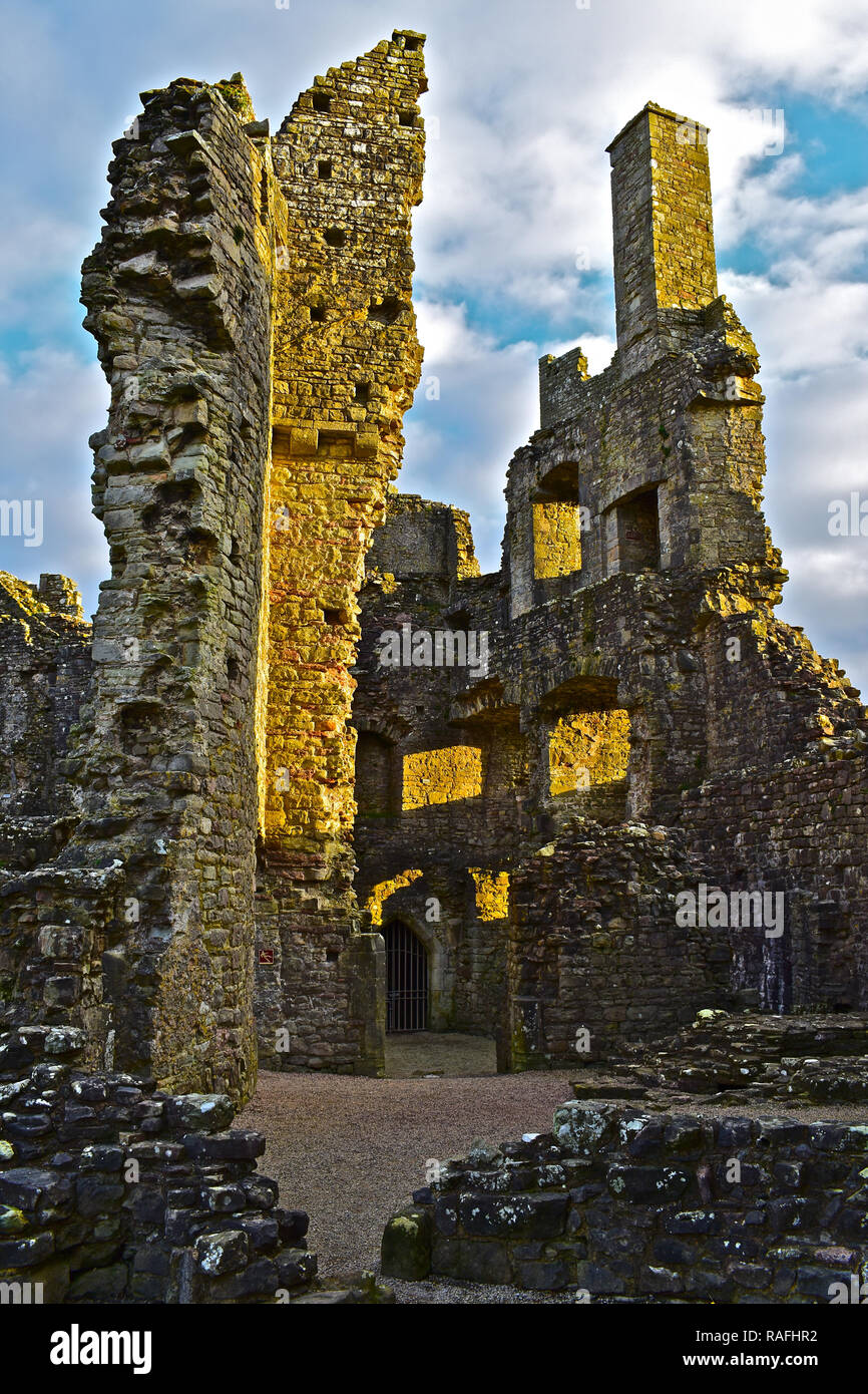 The historic remains of Coity Castle nr Bridgend, in the warm glow of ...