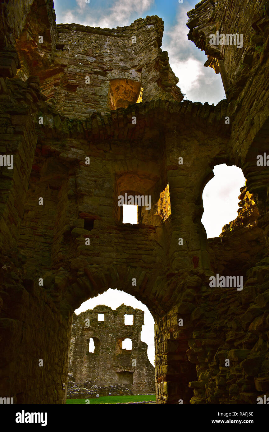 View of interior of Coity Castle through an old archway. This Ancient ...