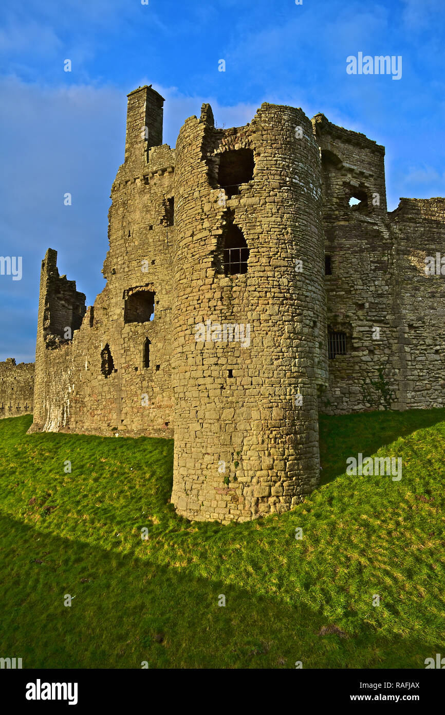 The historic remains of Coity Castle nr Bridgend, in the warm glow of ...