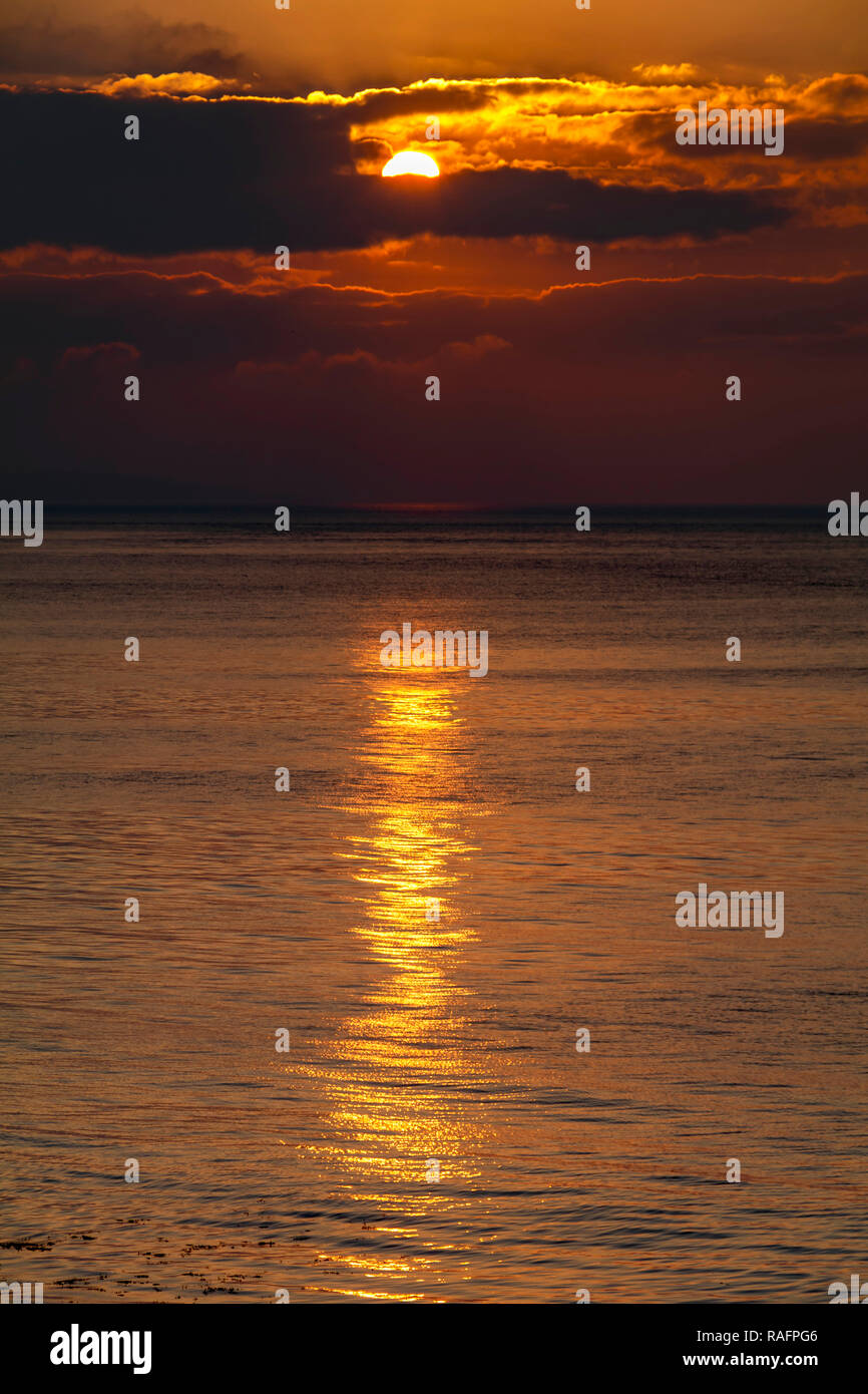 Streak of sunlight across the sea Stock Photo - Alamy