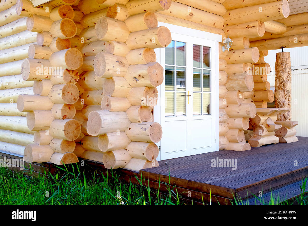 Country log house. Beautiful summer cottage greenery in the garden ...