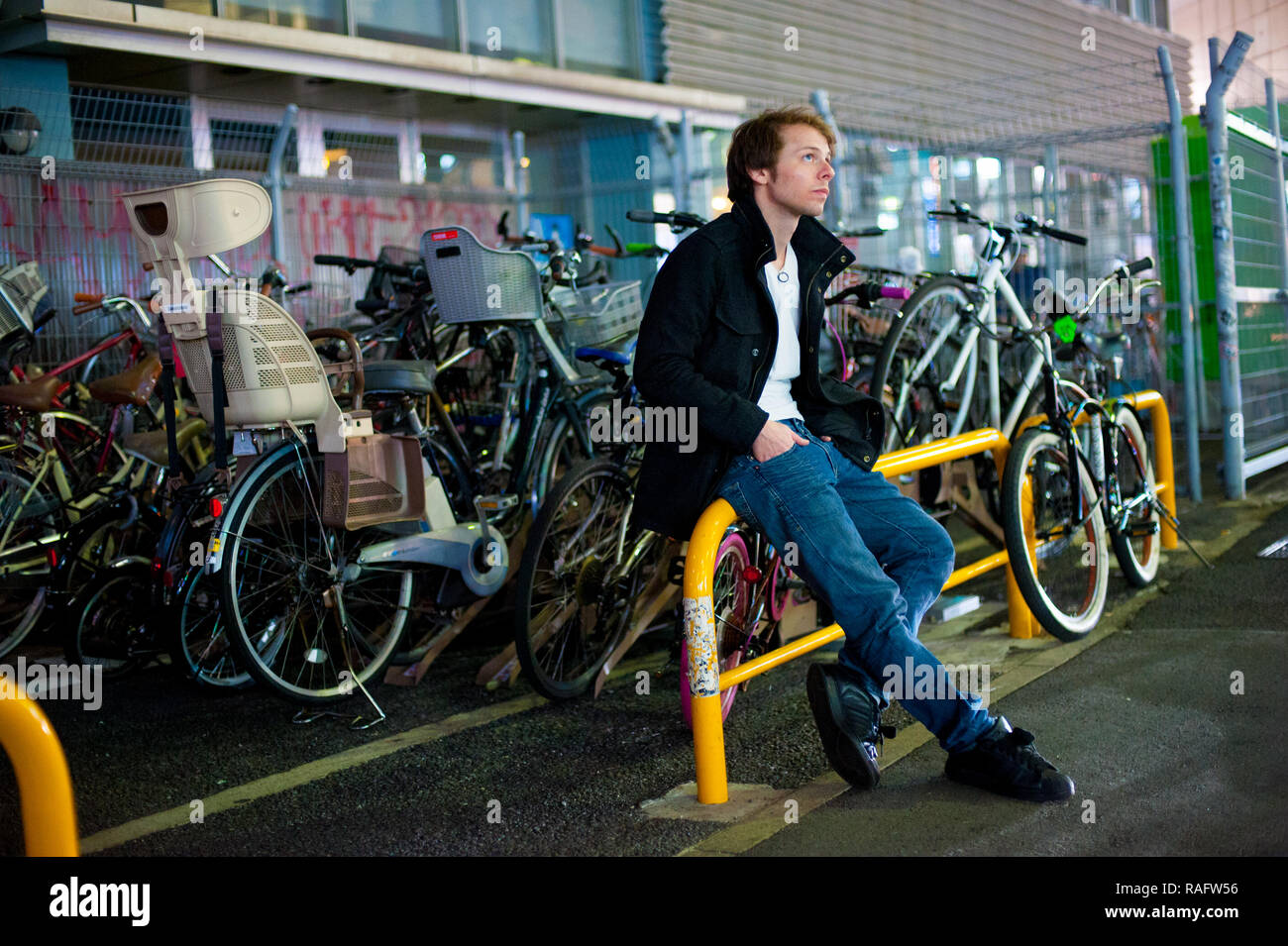 Caucasian male model poses for pictures on the street Stock Photo - Alamy