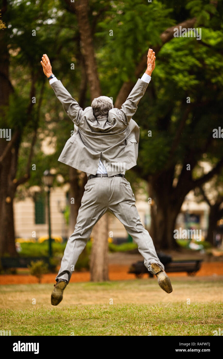 Middle aged man jumping for joy hi-res stock photography and images - Alamy