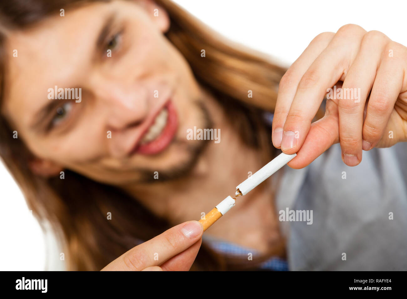 Young man breake down cigarette. Winning with addicted nicotine ...