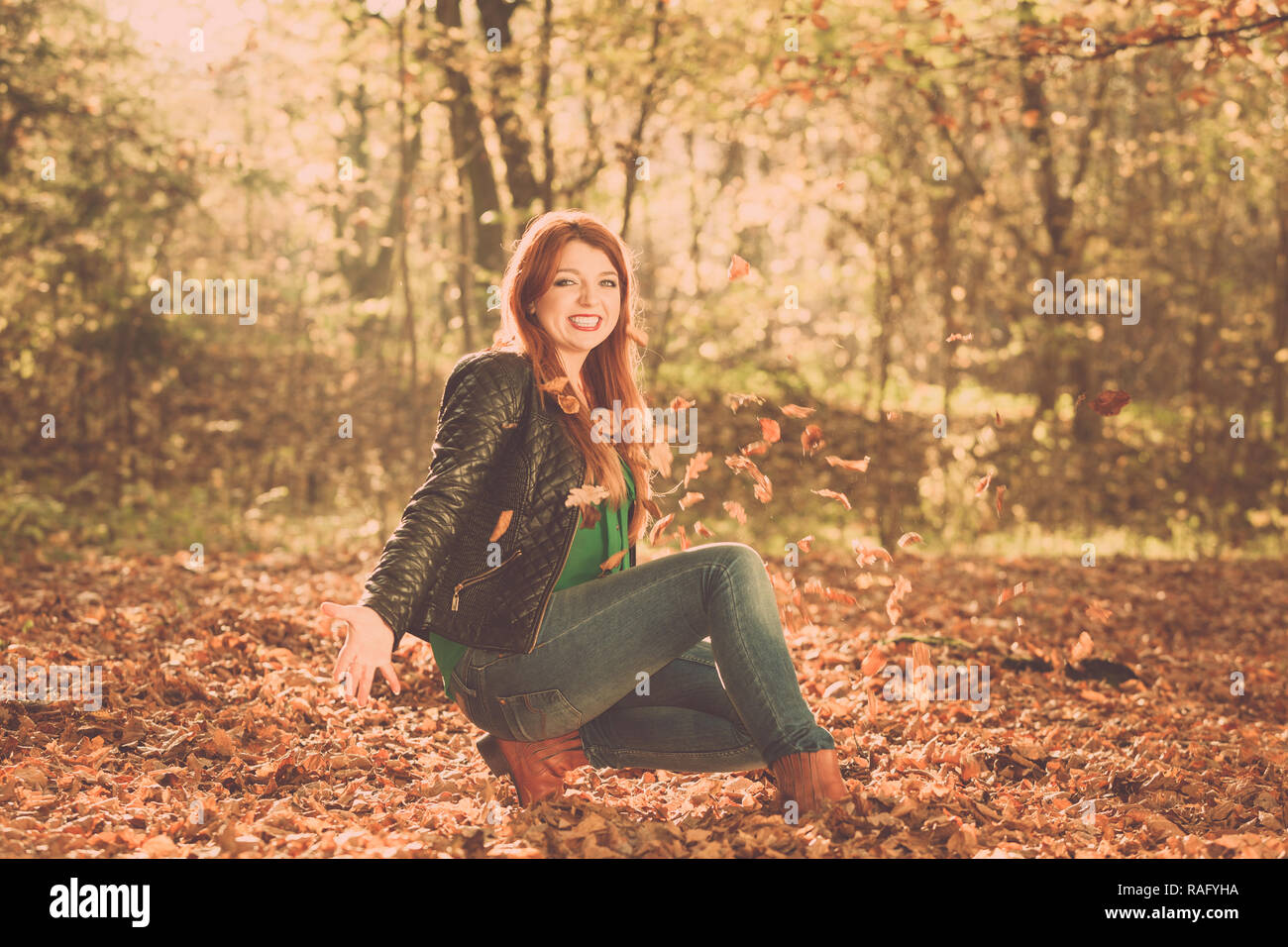 Relax leisure outdoor nature woodland concept. Cheerful ginger woman in park. Young redhead lady ...