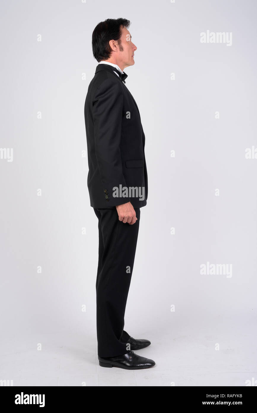 Handsome man wearing tuxedo bowtie hi-res stock photography and images ...