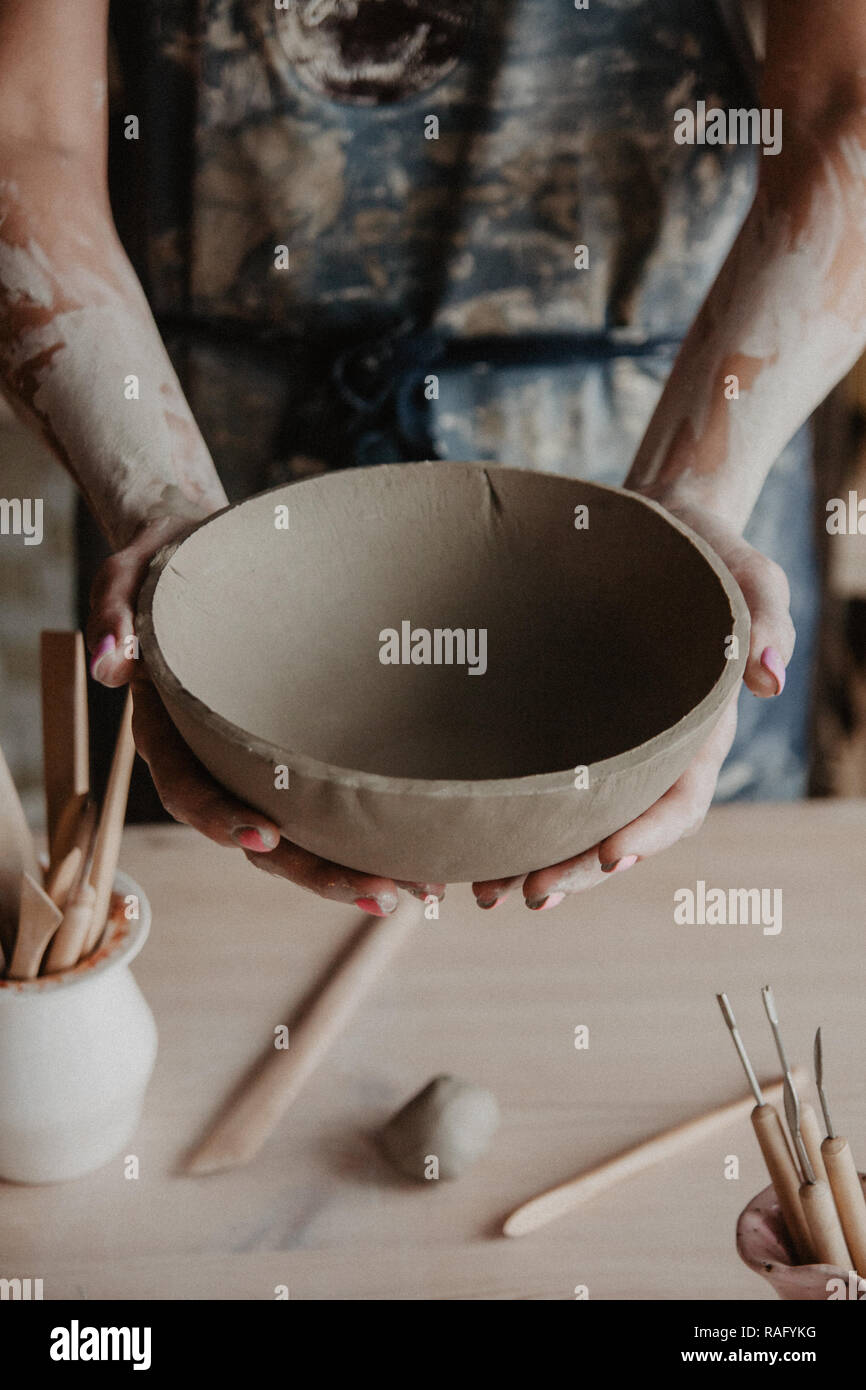 Pottery, clay, ceramics art concept closeup on hands of young master ...