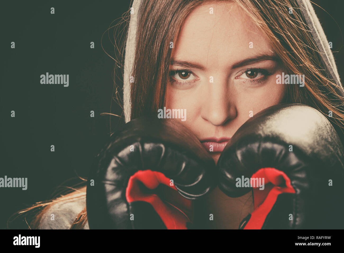 Fighting boxing and defense. Sportsmanship and strong body. Young woman ...