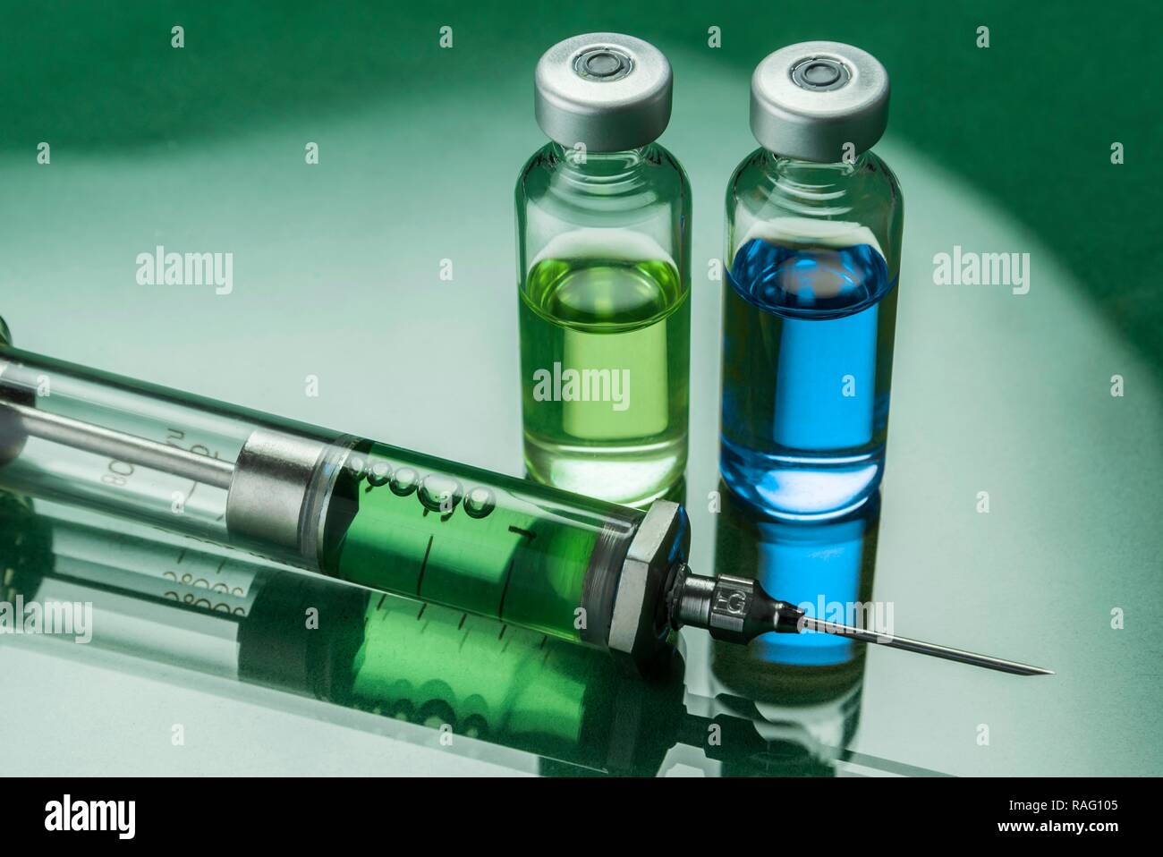 Several vials and syringe in laboratory, conceptual image Stock Photo - Alamy