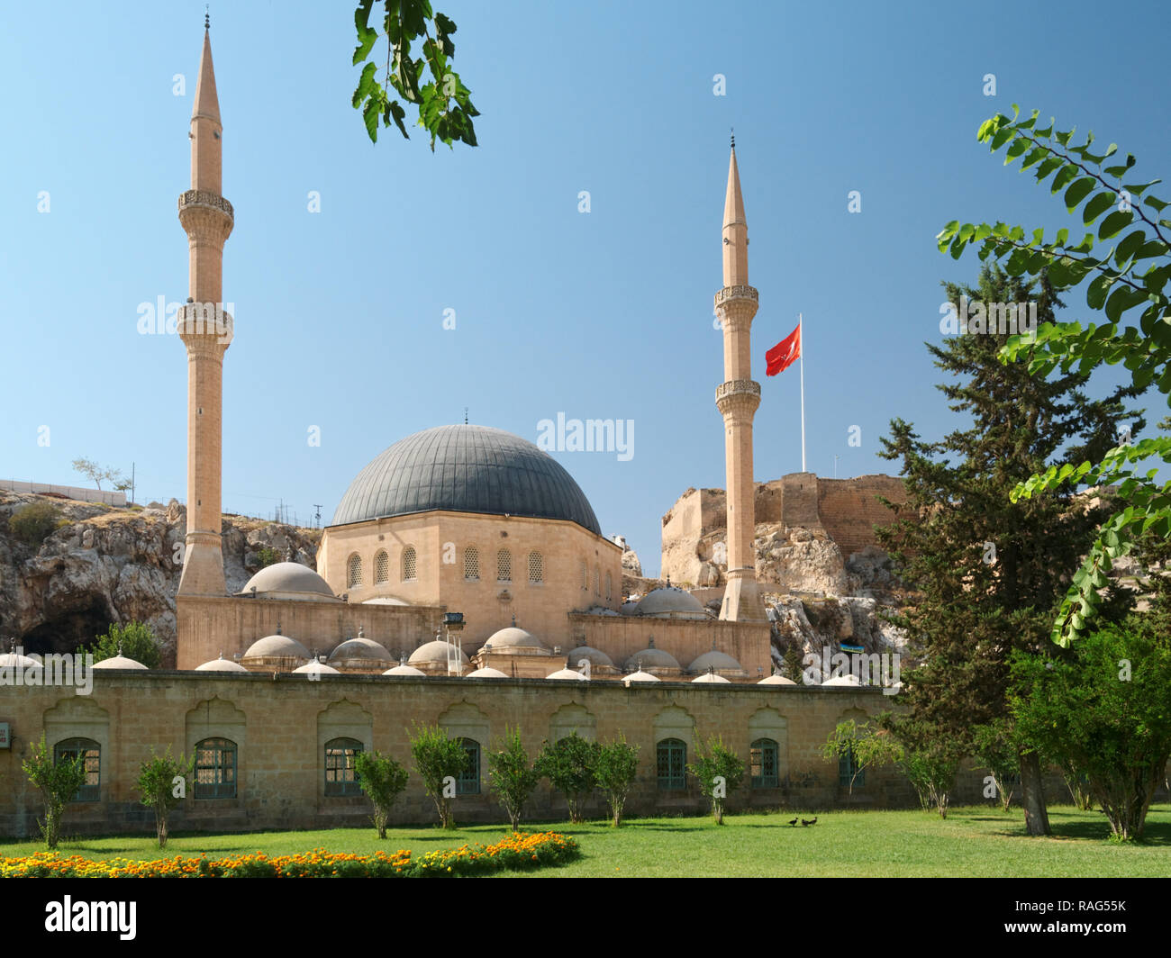 Urfa, Turkey - August 19, 2008: Yeni Dergah Mosque and Turkish flag ...
