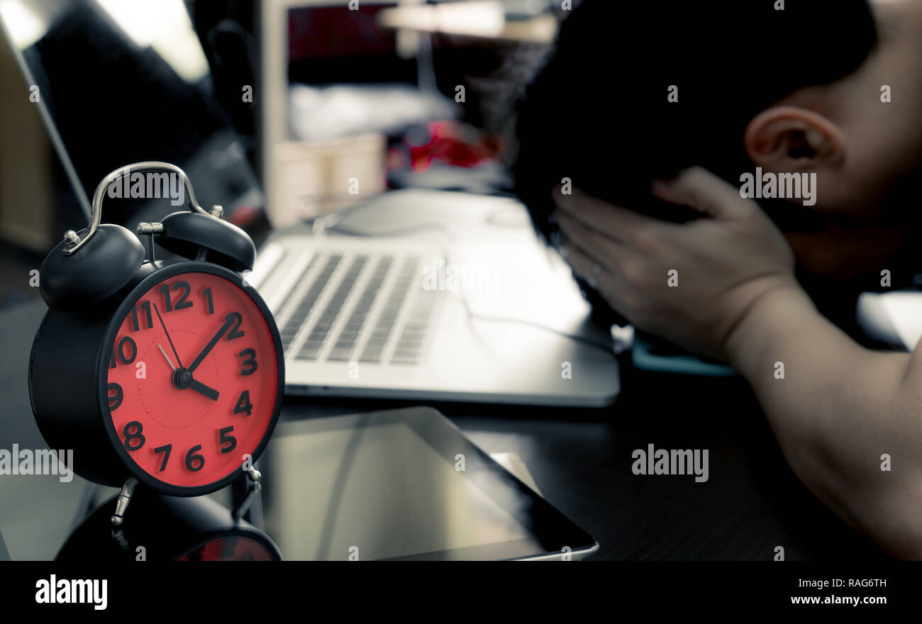 Office worker stress out on deadline clock Stock Photo - Alamy