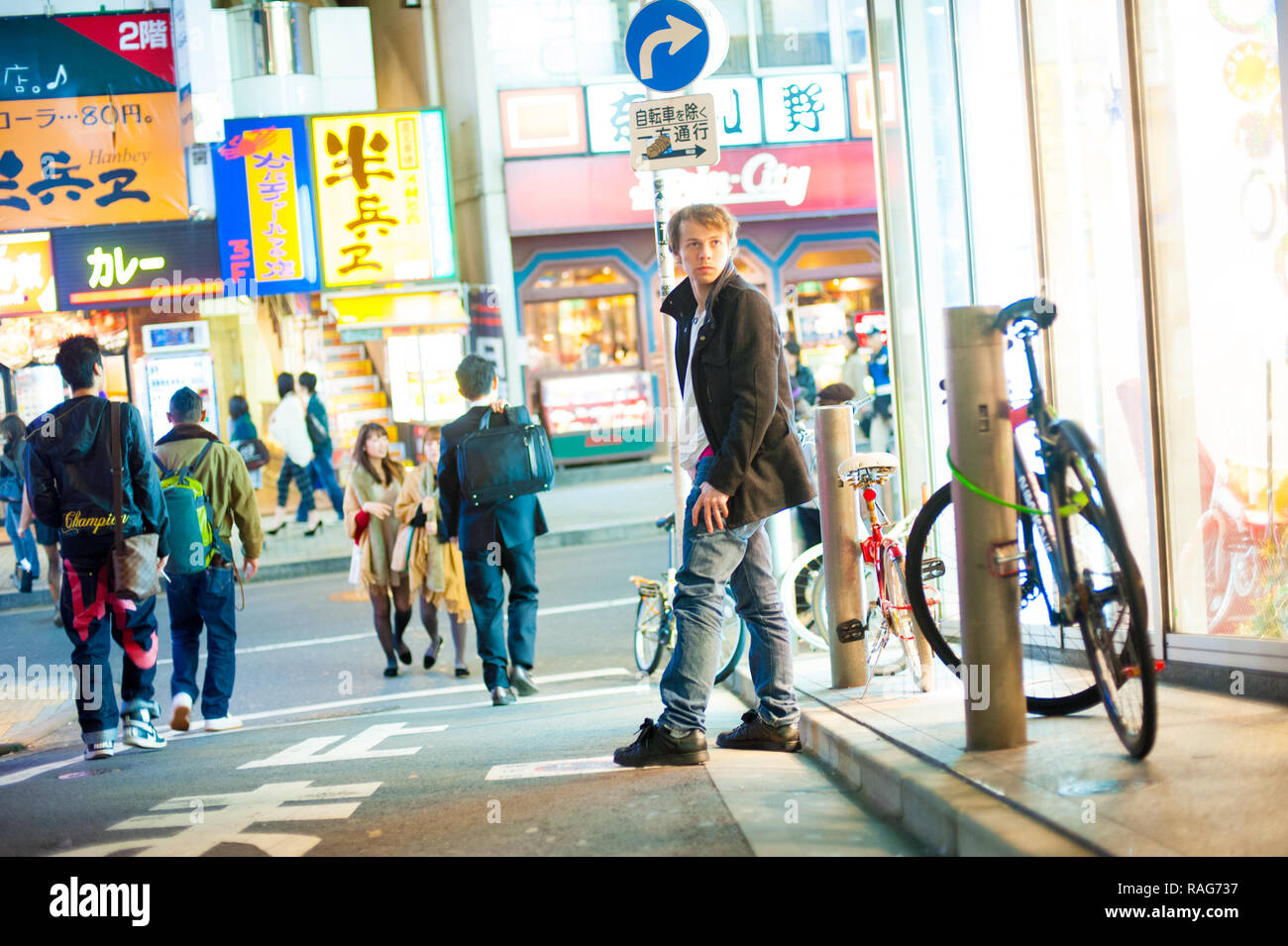 Caucasian male model poses for pictures on the street Stock Photo - Alamy