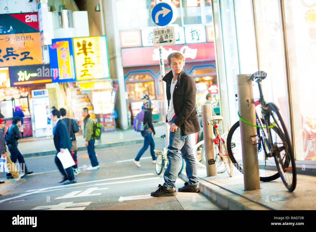 Caucasian male model poses for pictures on the street Stock Photo - Alamy