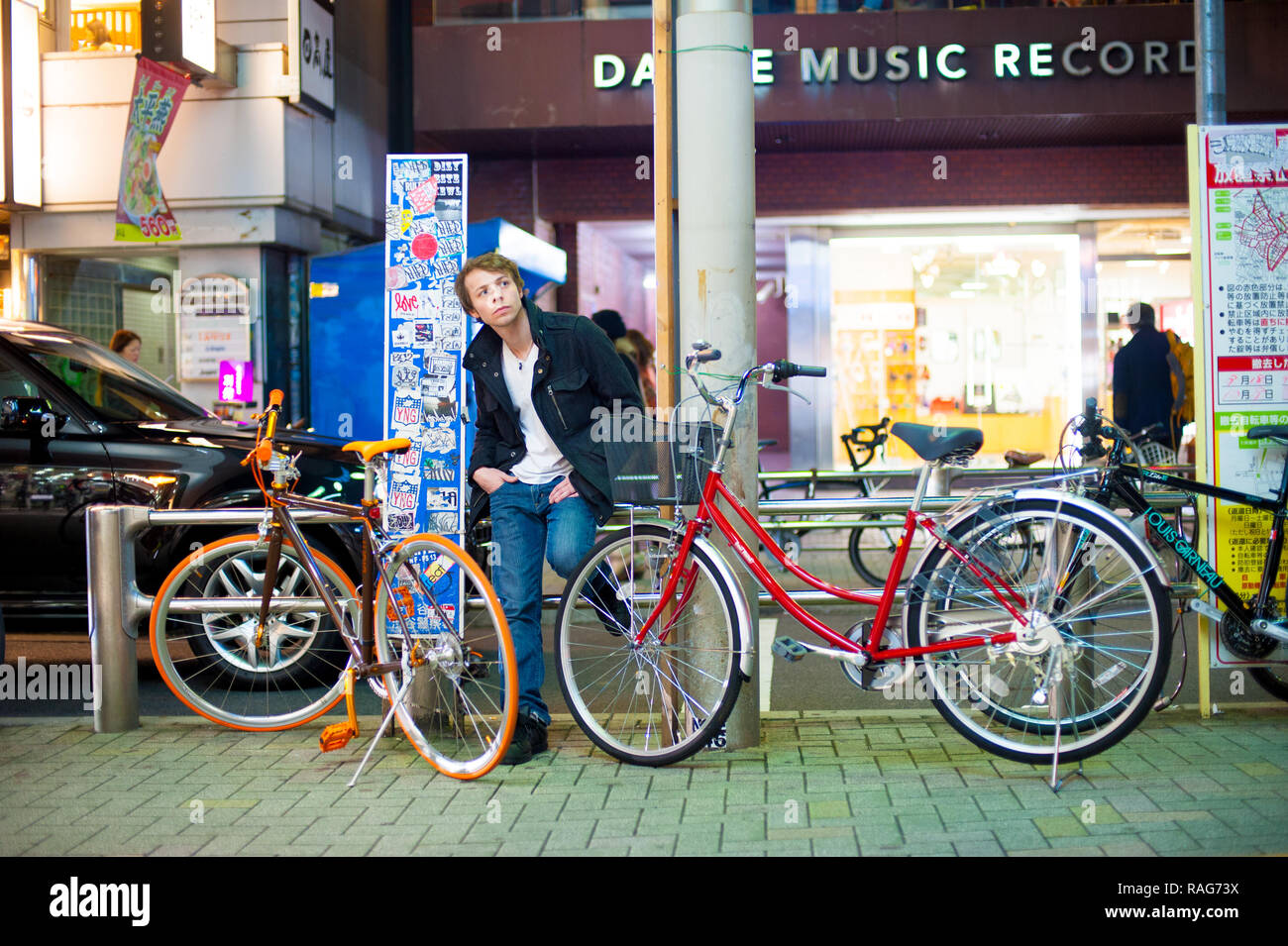 Caucasian male model poses for pictures on the street Stock Photo - Alamy