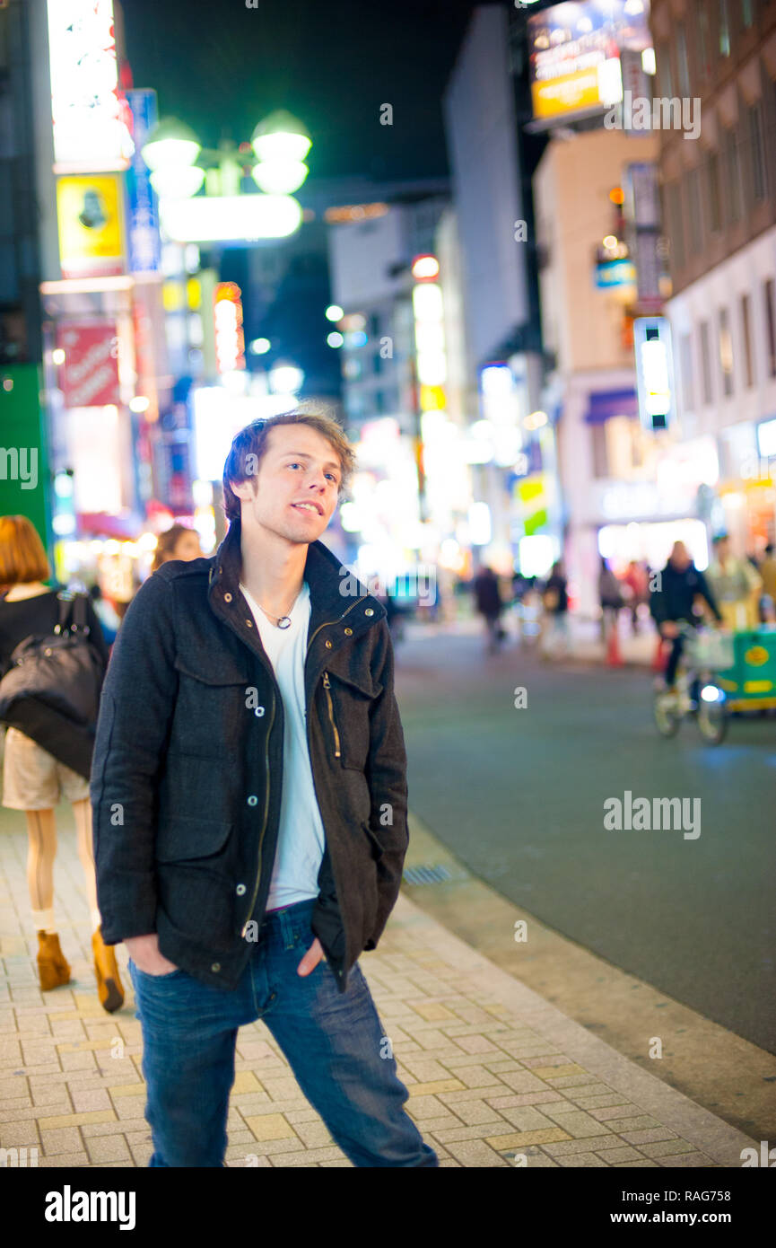 Caucasian male model poses for pictures on the street Stock Photo - Alamy