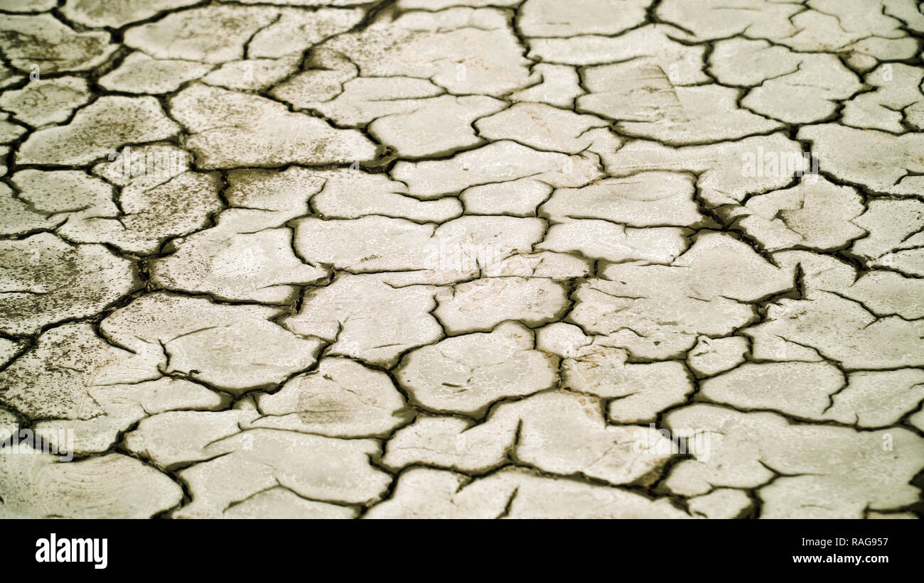 Dry cracked soil, Arid climate. Volcanic landscape around volcano ...