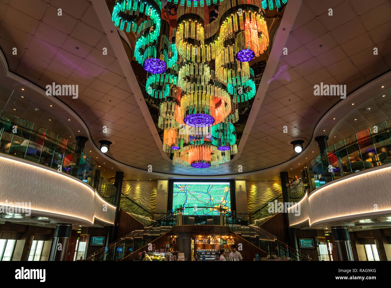 A large colorful light fixture in the atrium of the cruise ship ...