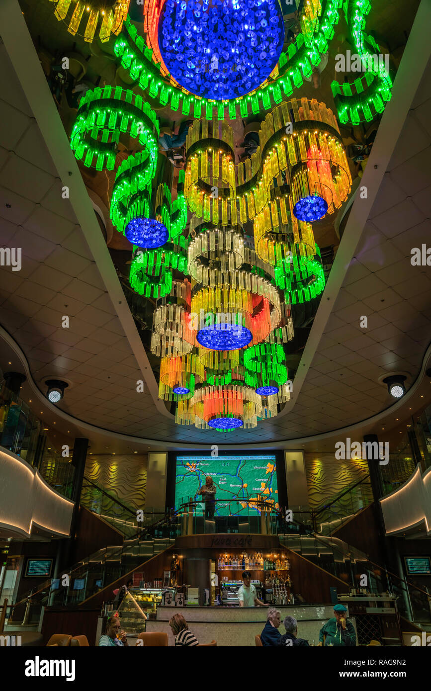A large colorful light fixture in the atrium of the cruise ship ...