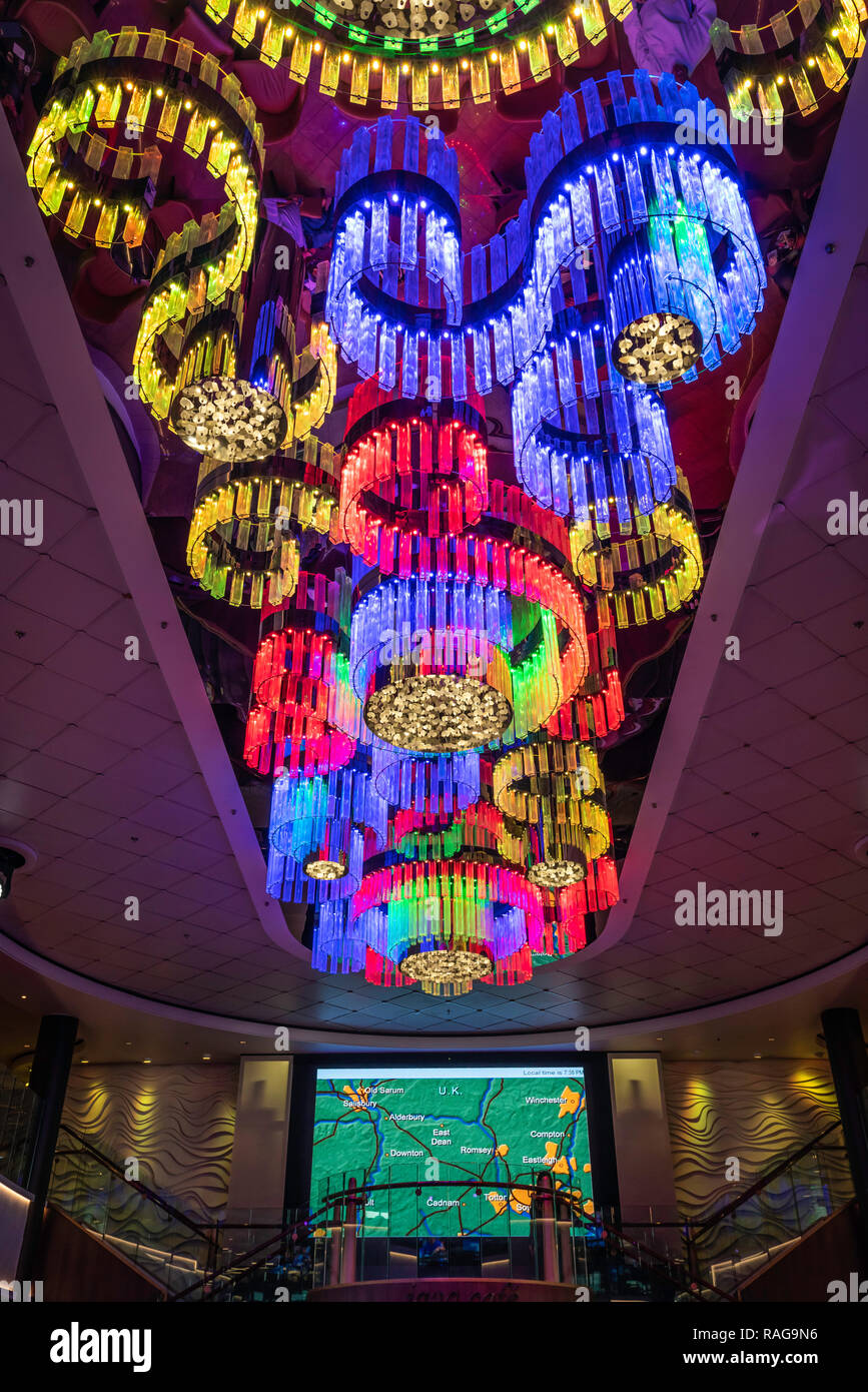 A large colorful light fixture in the atrium of the cruise ship ...