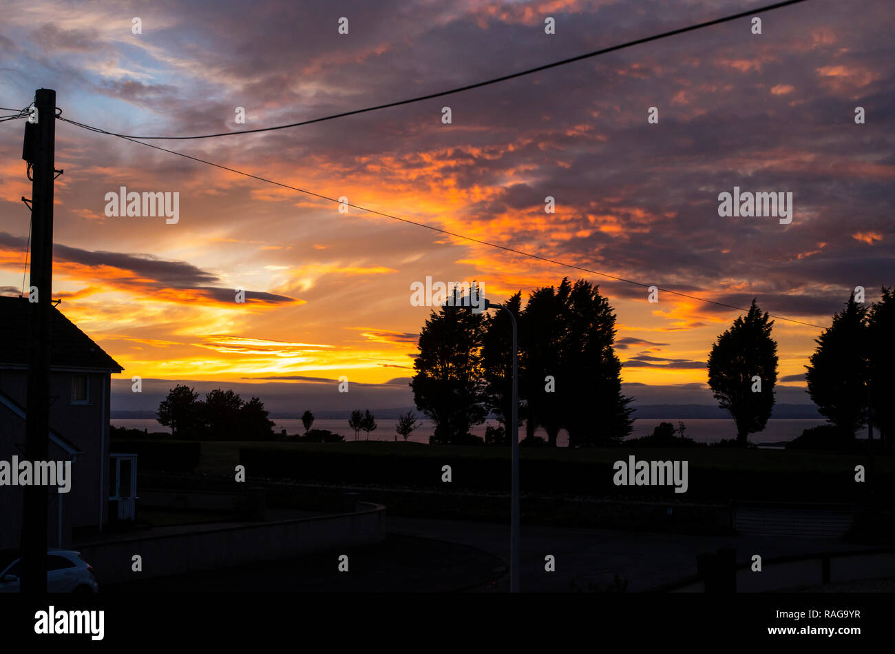 Sunset over Bristol Channel from suburb of Weston-super-Mare with the ...