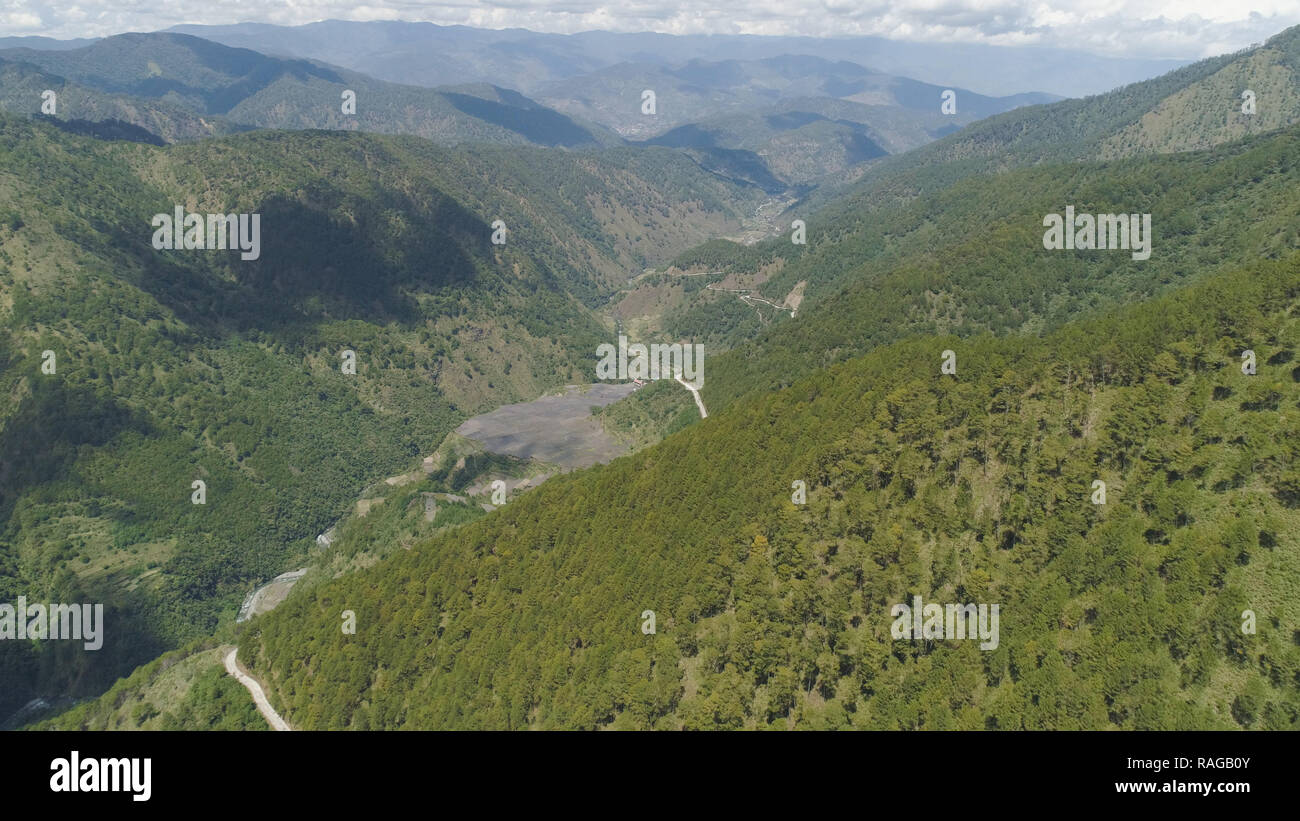 Aerial view of mountains covered forest, trees against the sky and ...