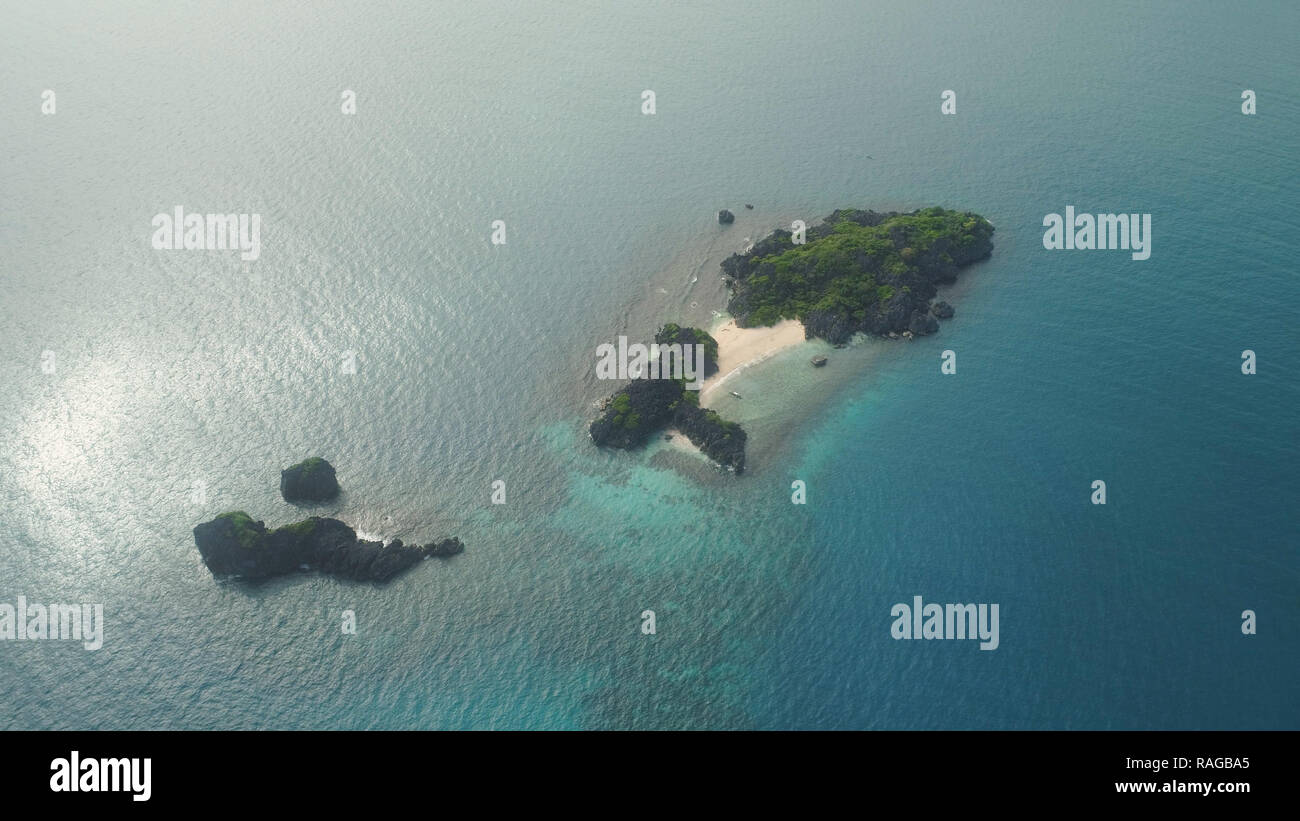 Aerial view island with sand beach and turquoise water in blue lagoon ...