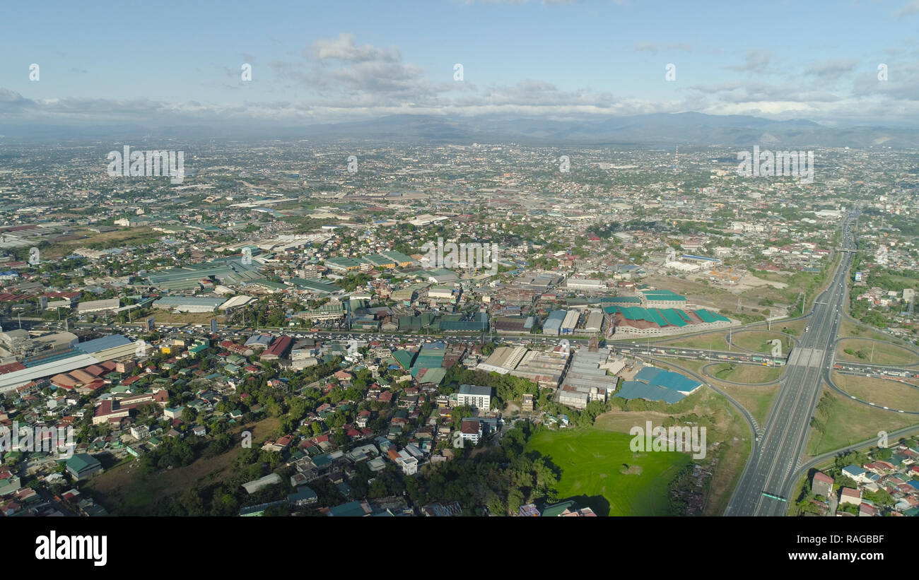 Aerial view of highway with road junction, car and traffic in Manila ...