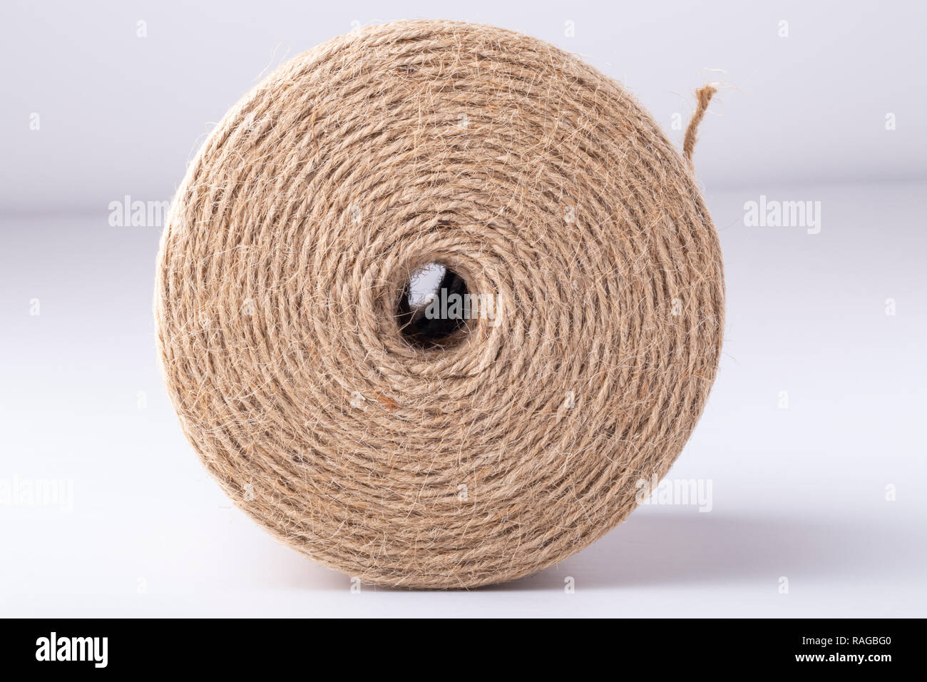 Natural jute rope, isolated on white background Stock Photo - Alamy