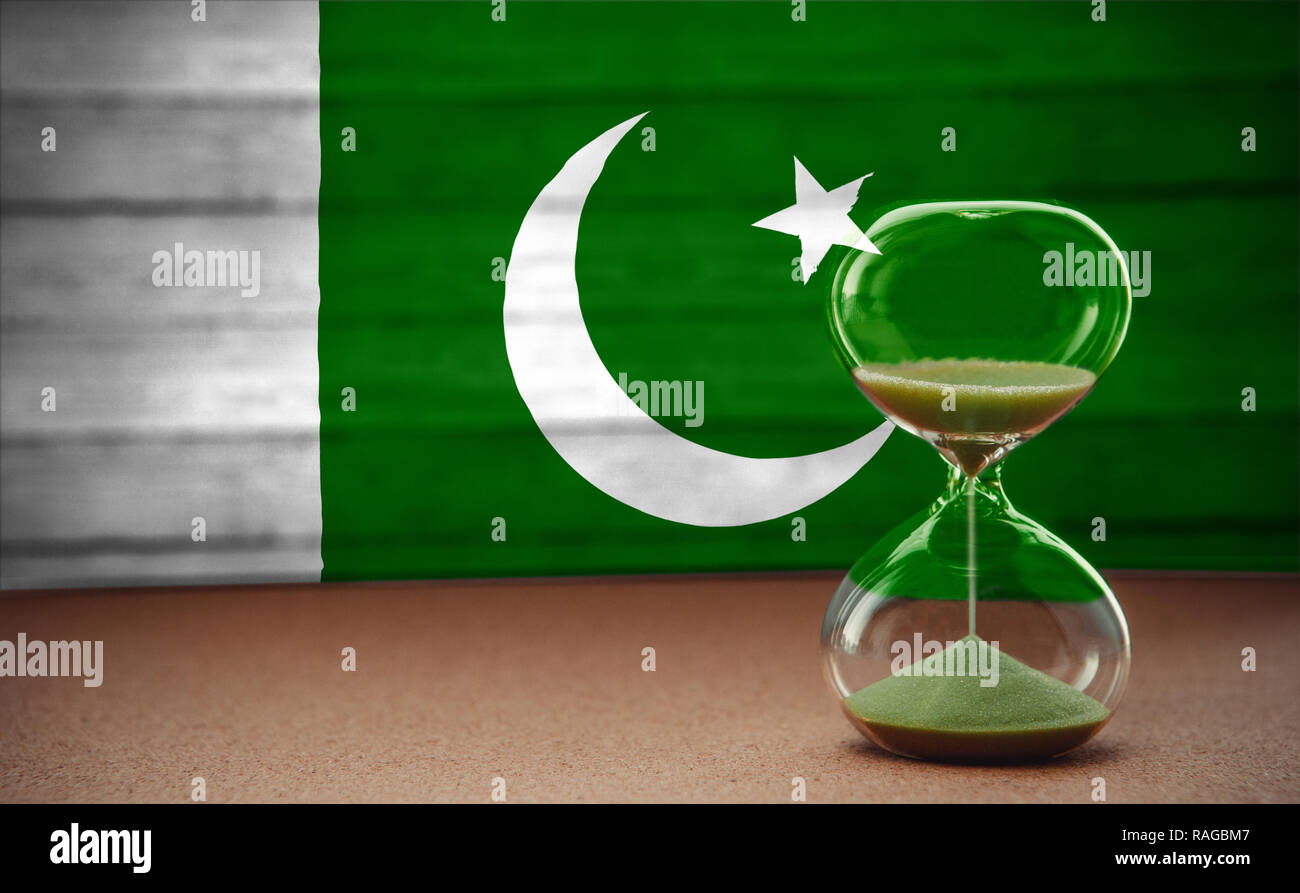Hourglass on the background of the Pakistan flag, the concept of time ...