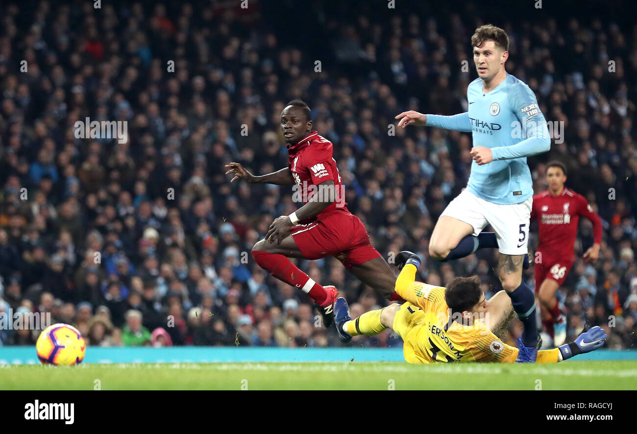Liverpool's Sadio Mane (left) sees his shot hit the post during the ...