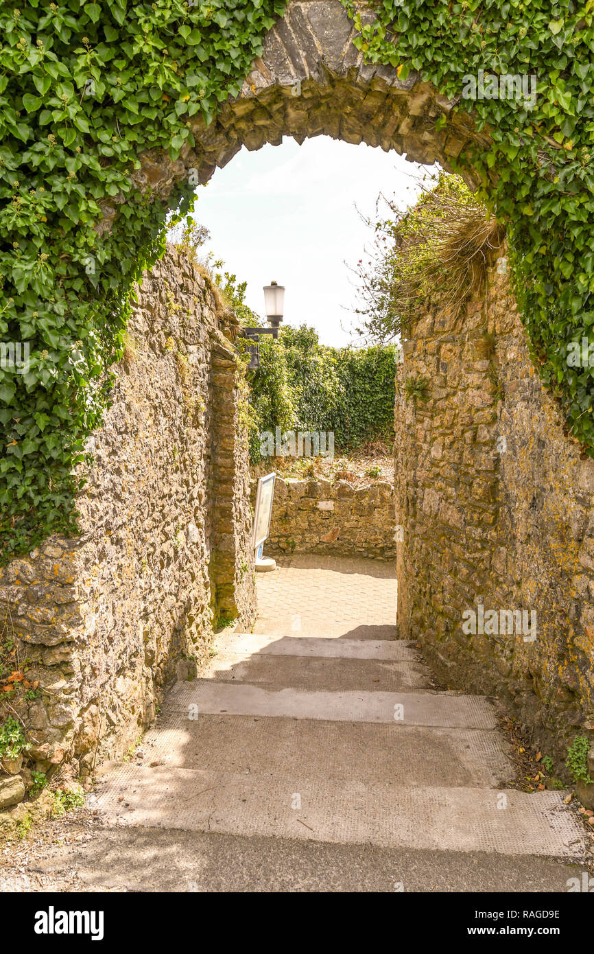TENBY, PEMBROKESHIRE, WALES - AUGUST 2018: Steps through a stone ...