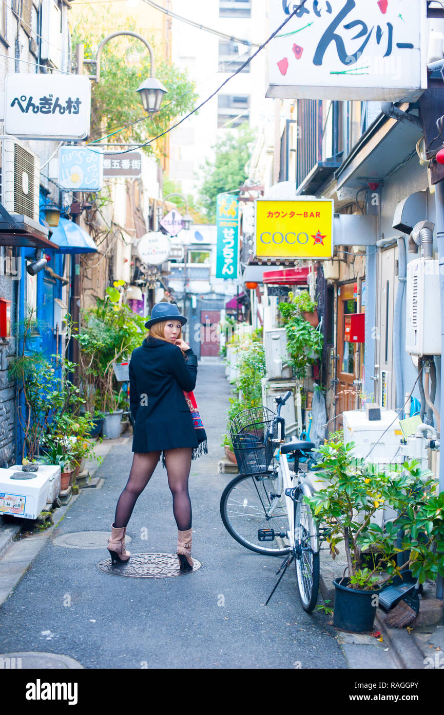 Asian female model poses for pictures on the street Stock Photo - Alamy