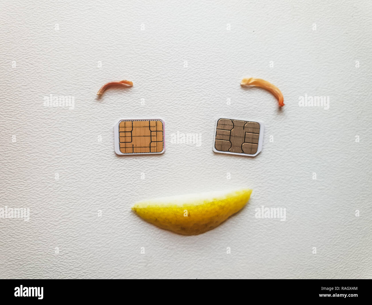 two micro sim cards lying in the shape of a smiling face Stock Photo ...