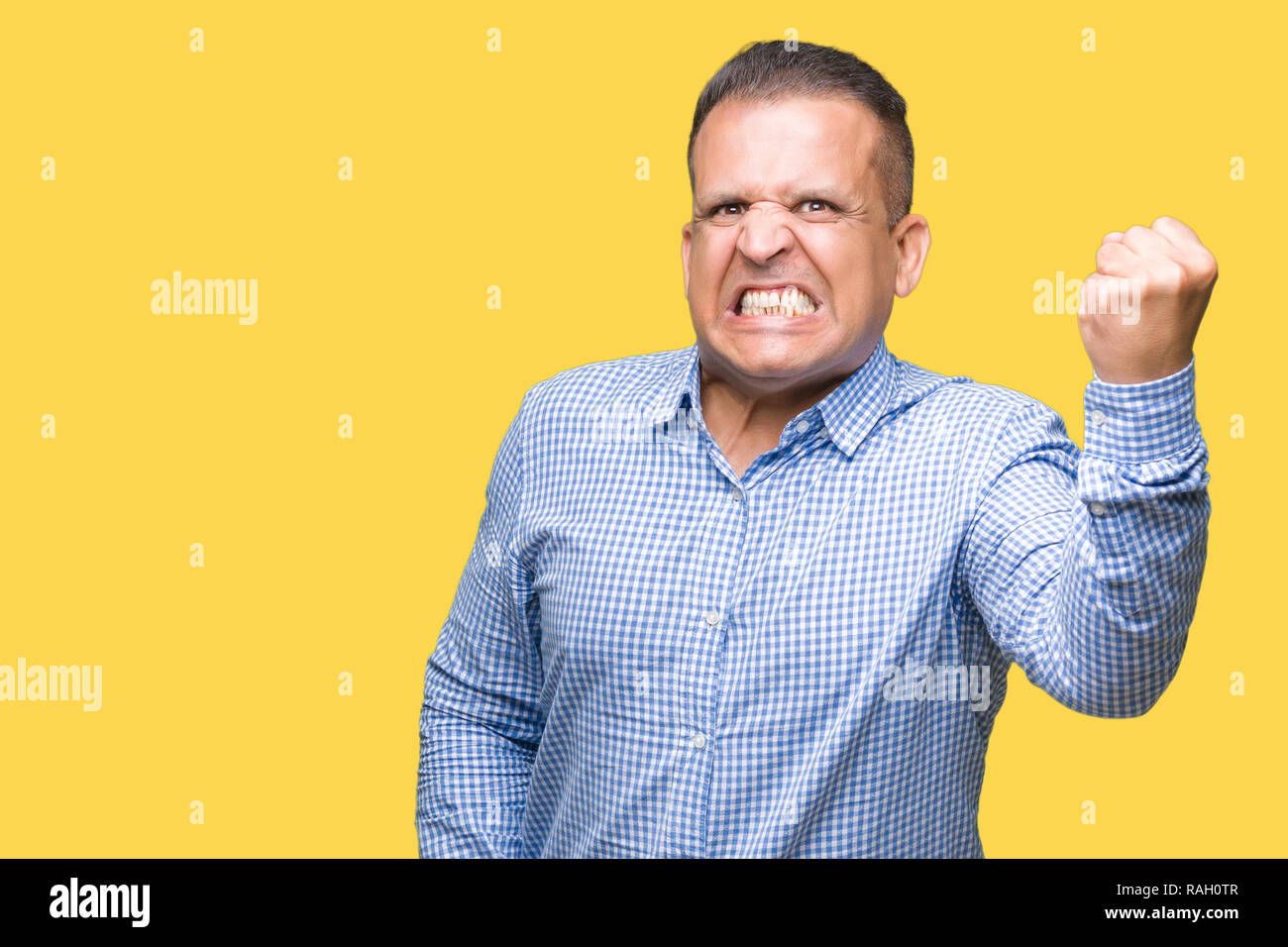 Middle age arab business man over isolated background angry and mad ...