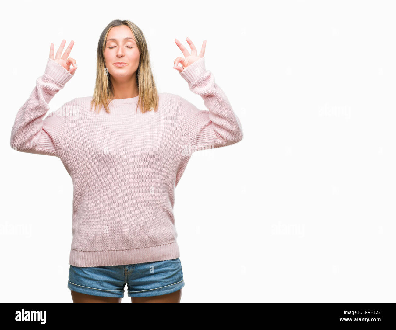 Young beautiful woman wearing winter sweater over isolated background ...