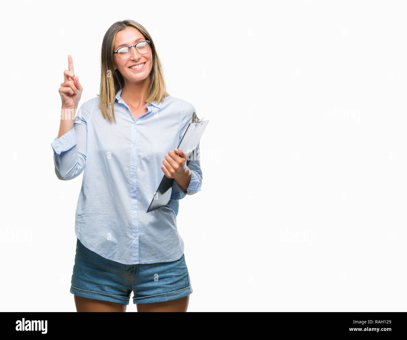 Young beautiful inspector business woman over isolated background ...