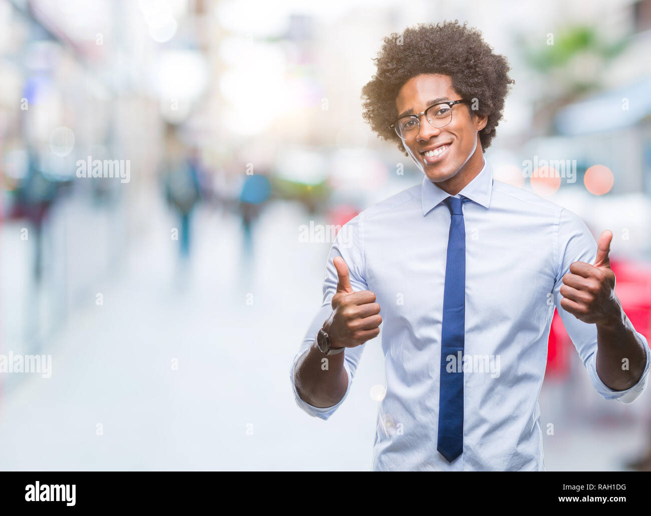Afro american business man wearing glasses over isolated background ...