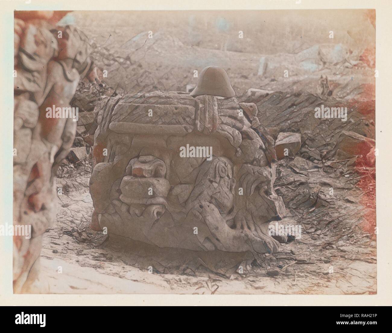 Warrior-head sculpture with pith helmet placed on top, Edmund Lincoln ...