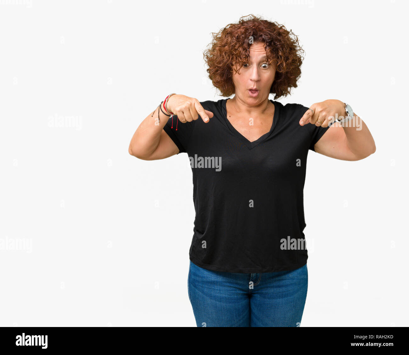 Beautiful middle ager senior woman over isolated background Pointing ...