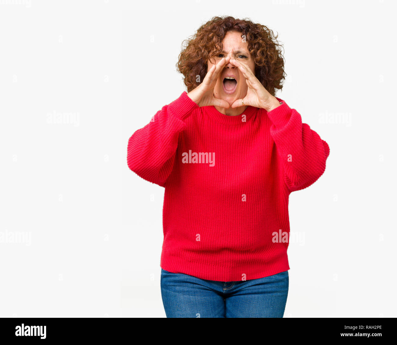 Beautiful middle ager senior woman red winter sweater over isolated ...