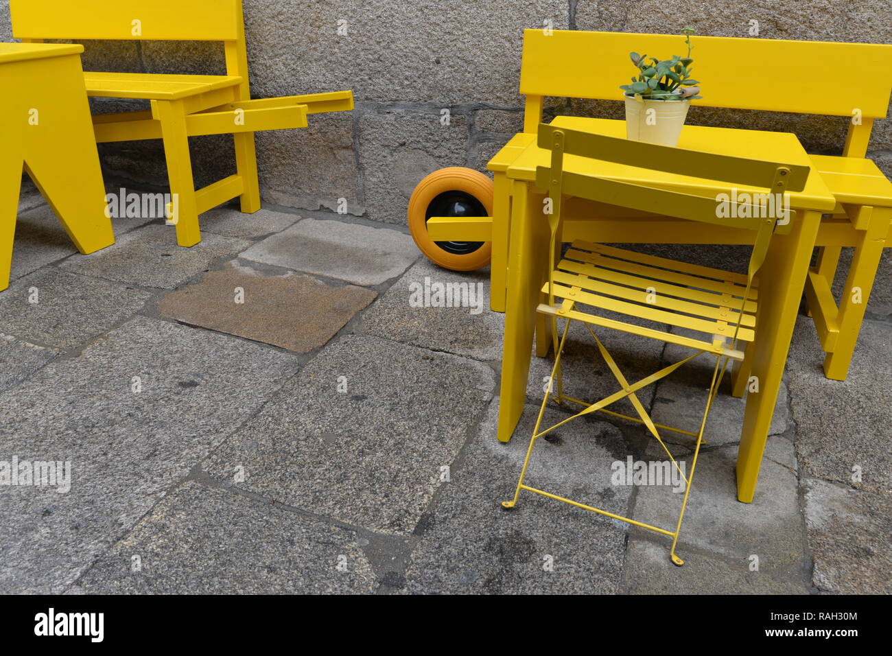 A set of yellow chairs and table in Tui - Galicia, Spain Stock Photo ...