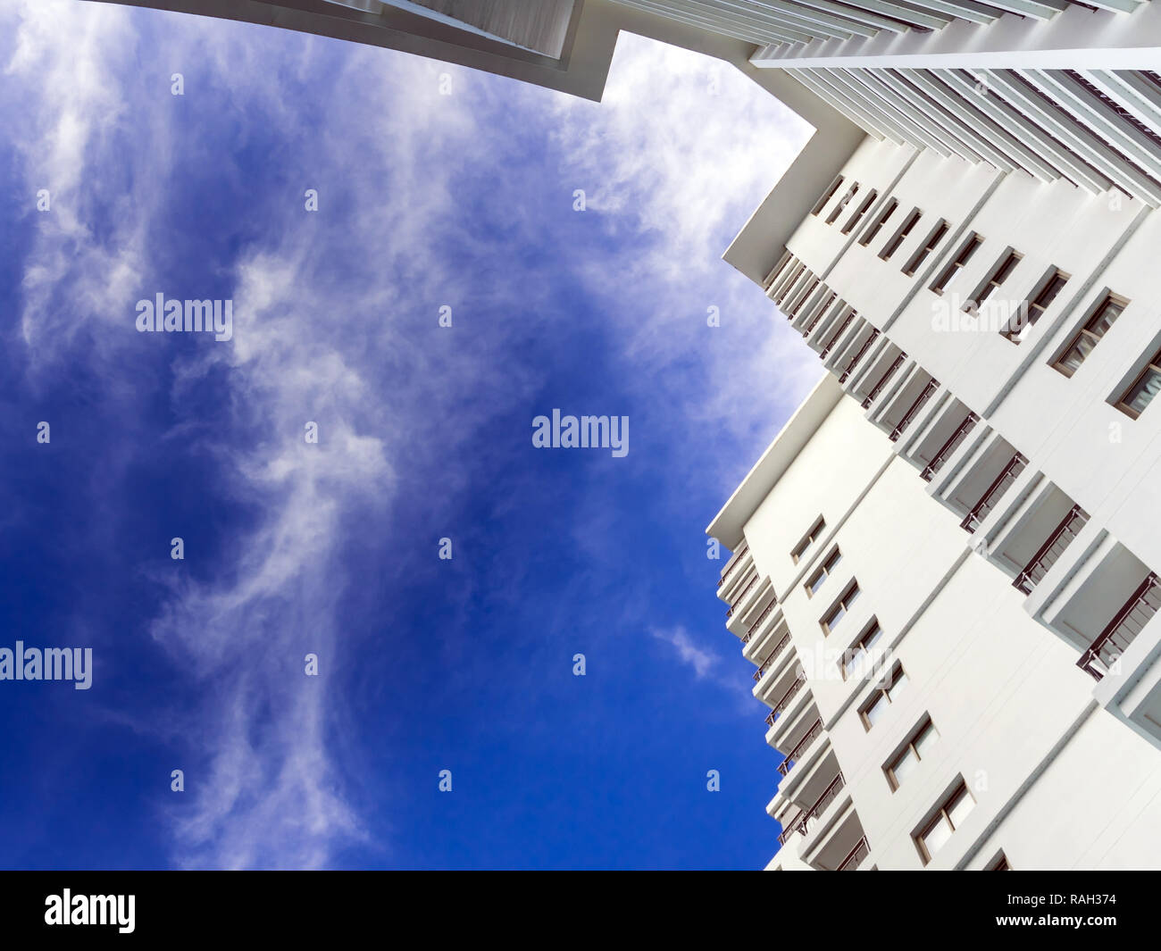 High-rise building and bright blue sky Stock Photo - Alamy