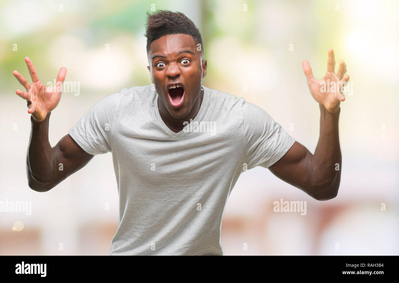 Young african american man over isolated background celebrating crazy ...