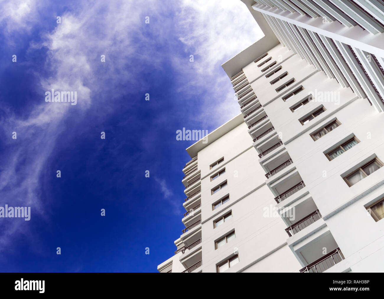High-rise building and bright blue sky Stock Photo - Alamy