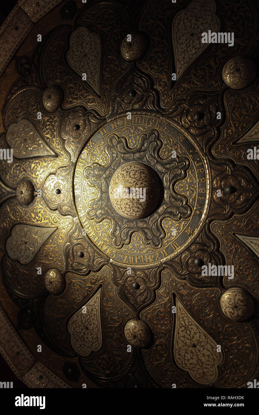 gold patterns on old armor, Ancient shield close to Stock Photo - Alamy
