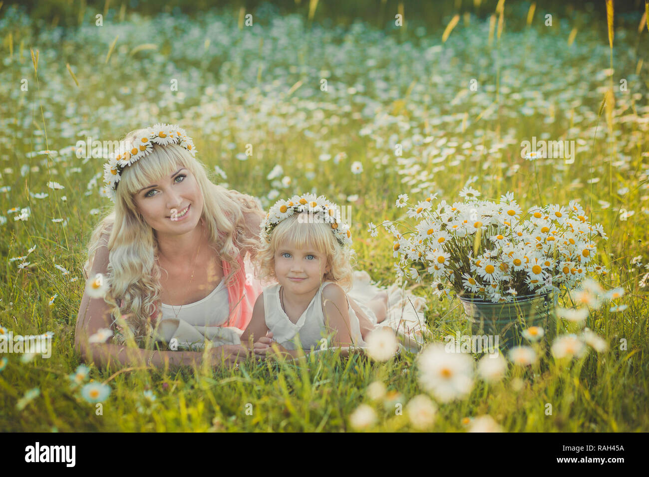 Magnificent picture of blond adorable lady woman mother mom in pink airy dress with daughter ...