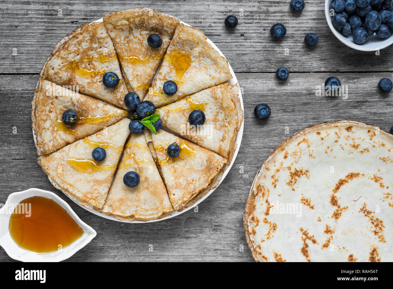 Stack pancakes honey sauce blueberries hi-res stock photography and ...