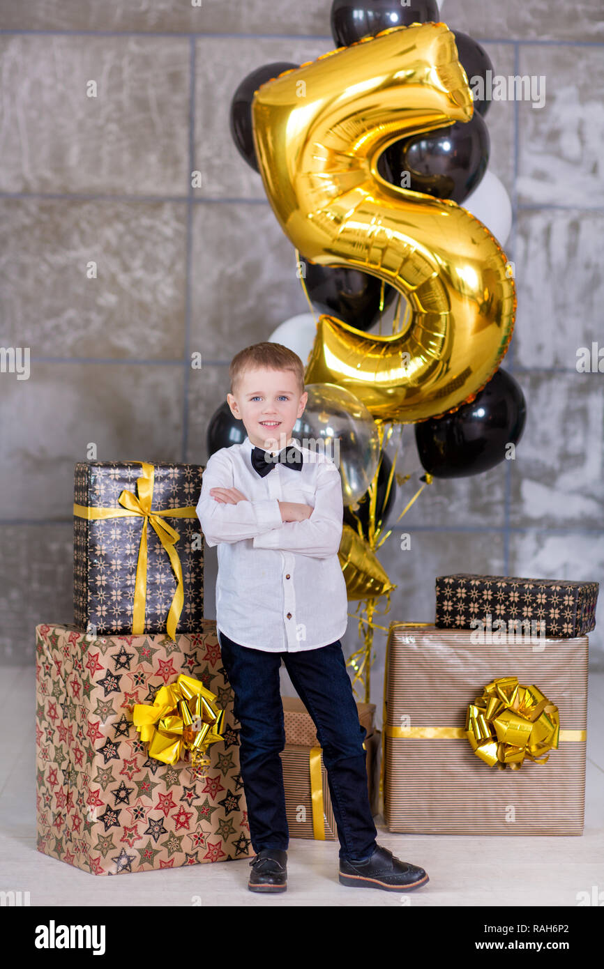 Beautiful kids, little boys celebrating birthday and blowing candles on ...